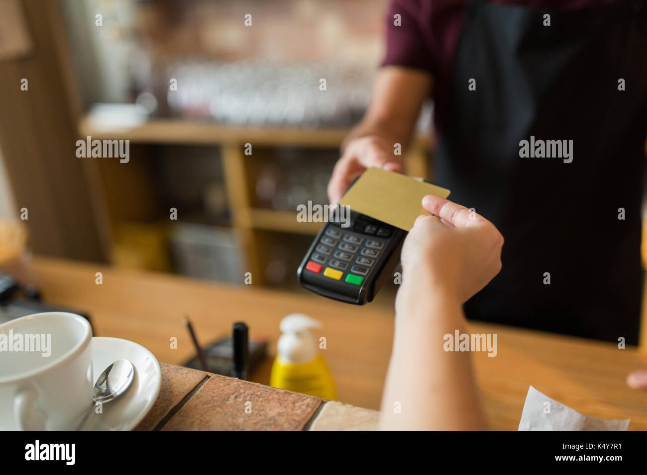 hands with payment terminal and credit card Stock Photo - Alamy