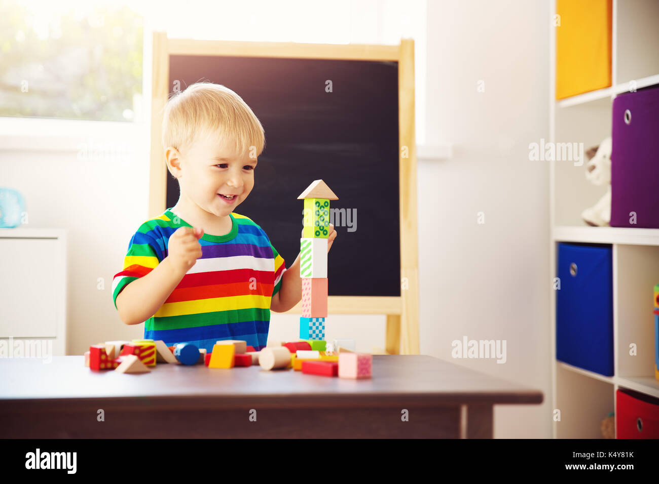 Little child playing with blocks Stock Photo - Alamy