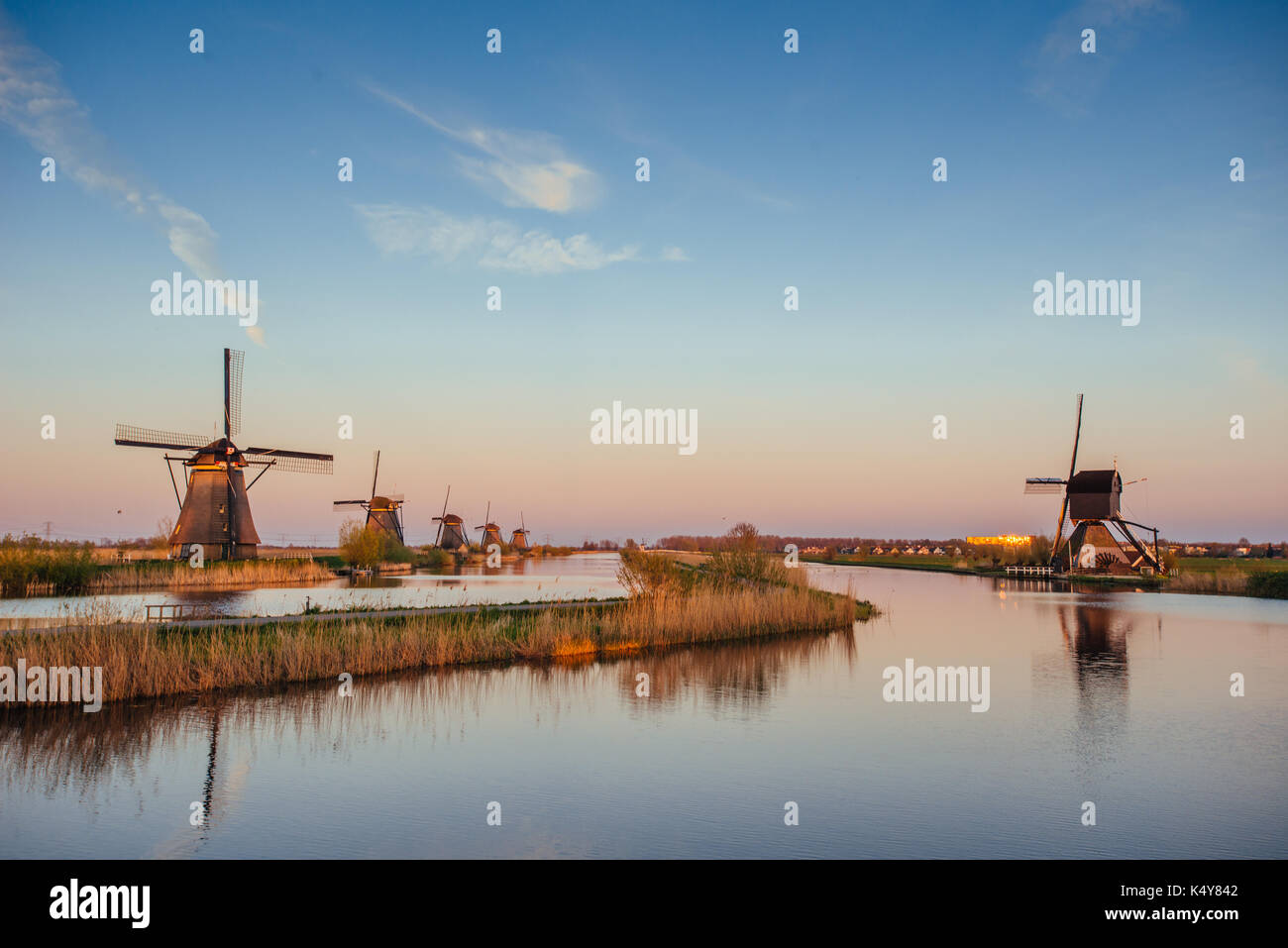 Colorful spring day with traditional Dutch windmills canal in Rotterdam ...