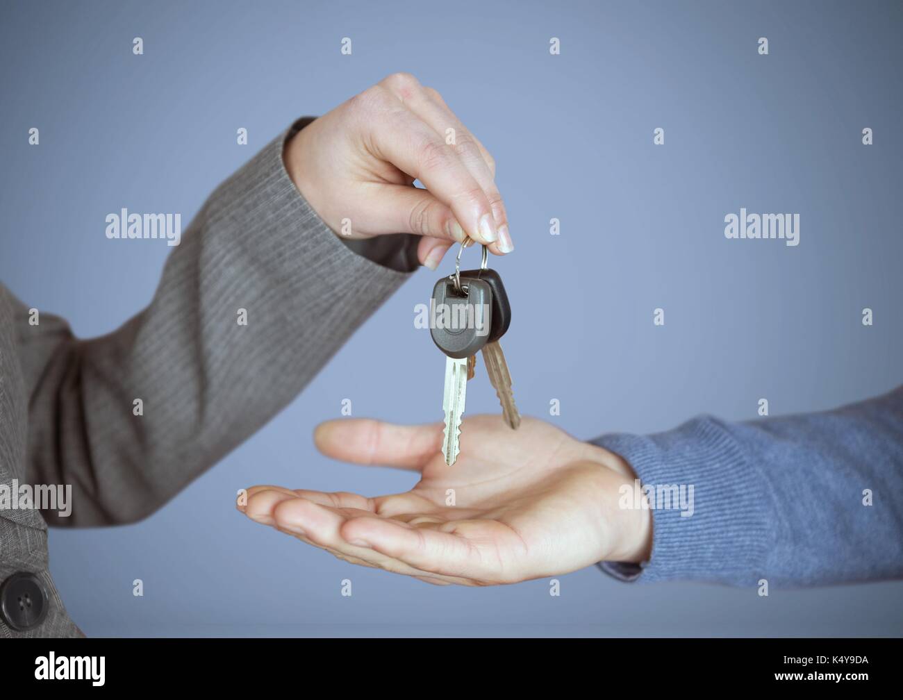 Digital composite of Hands Holding key in front of vignette Stock Photo ...