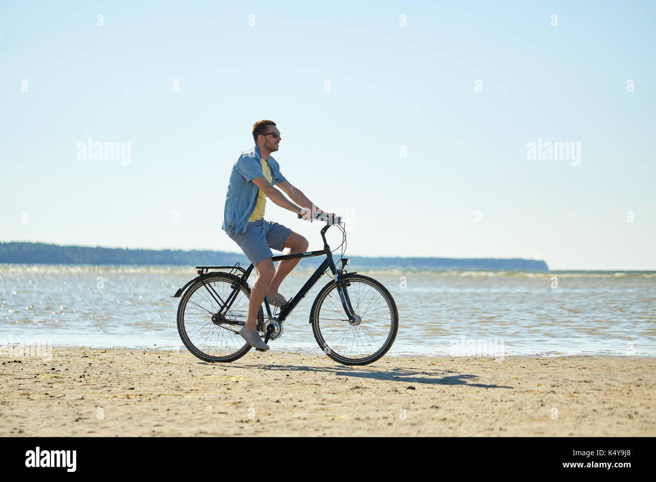 Guy riding beach bike hi-res stock photography and images - Alamy