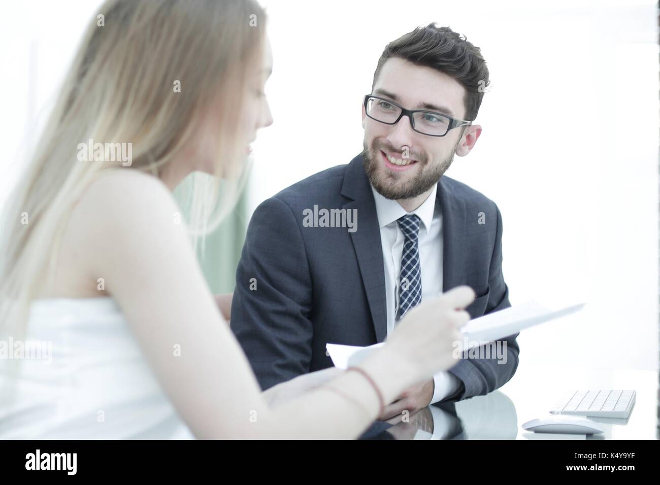 Senior manager and employee discussing financial documents Stock Photo ...