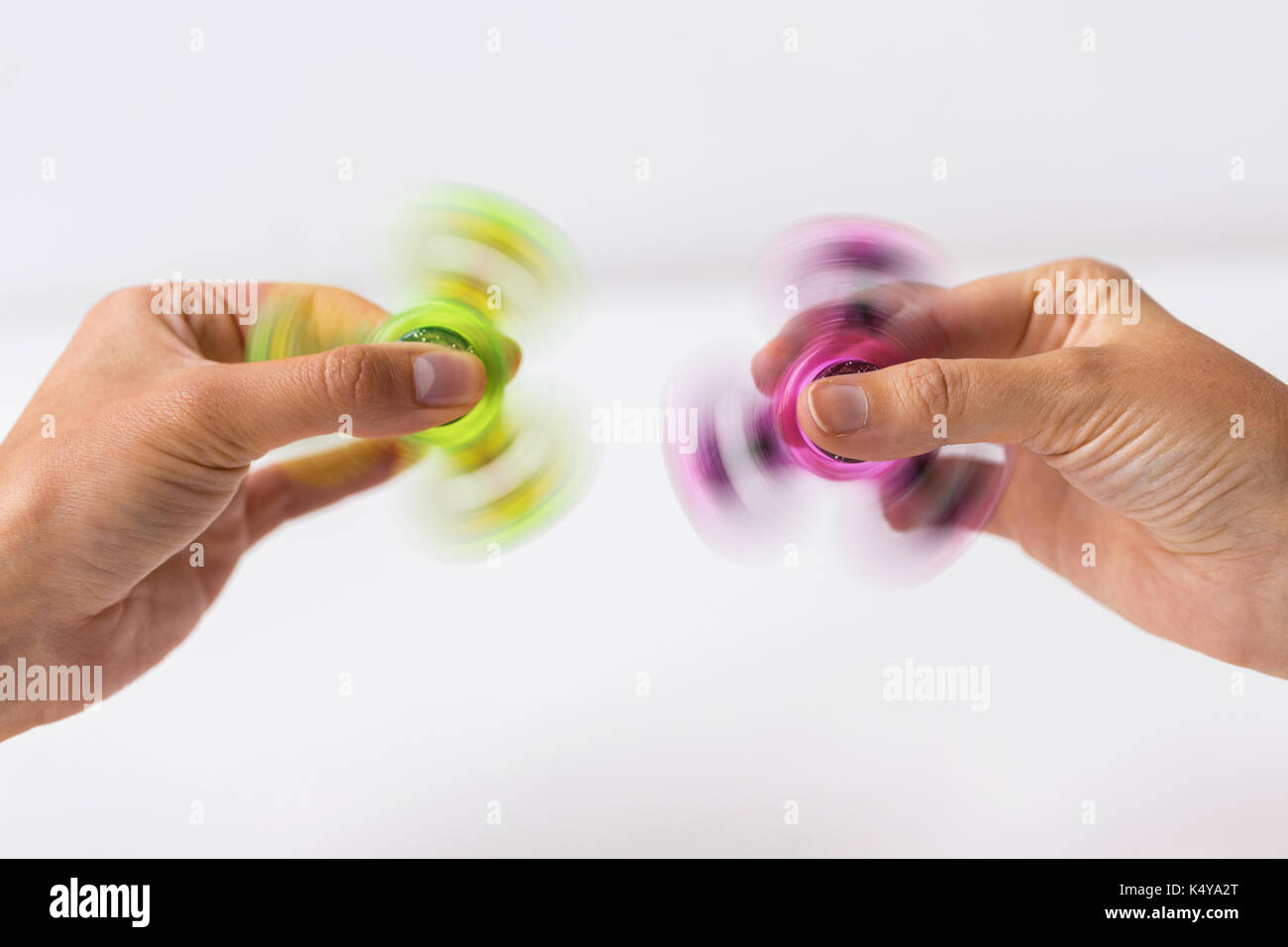 Woman playing fidget spinner hi-res stock photography and images - Alamy