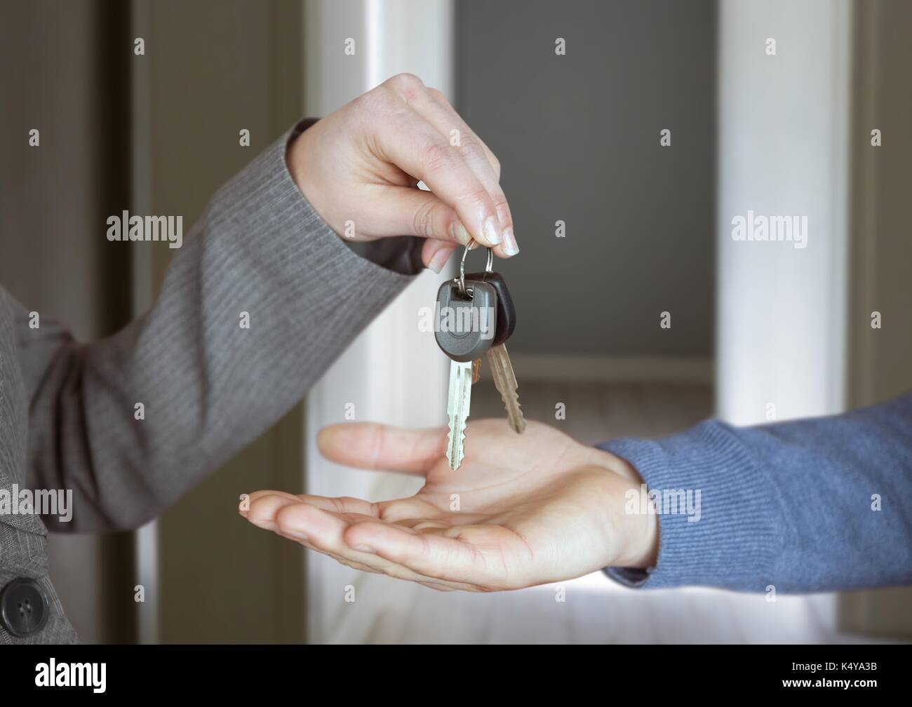Digital composite of Hands Holding key in home Stock Photo - Alamy