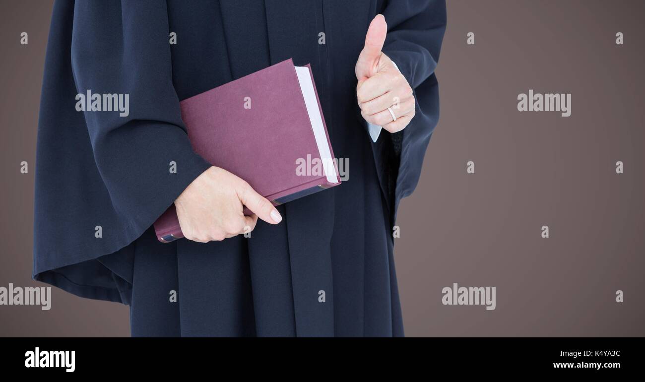Digital composite of Female judge mid section with book and thumbs up ...