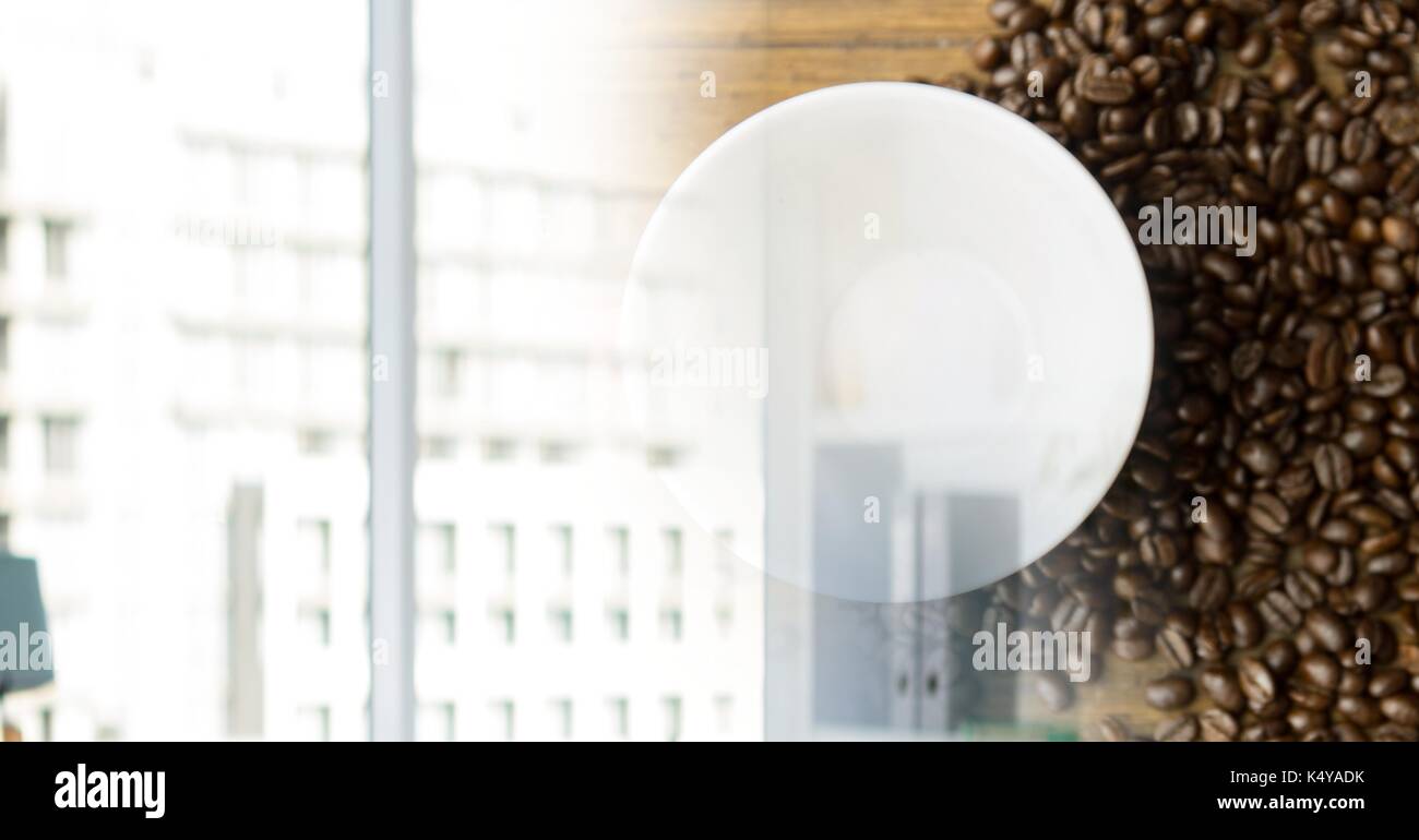 Digital composite of Overhead of coffee cup with beans and blurry ...