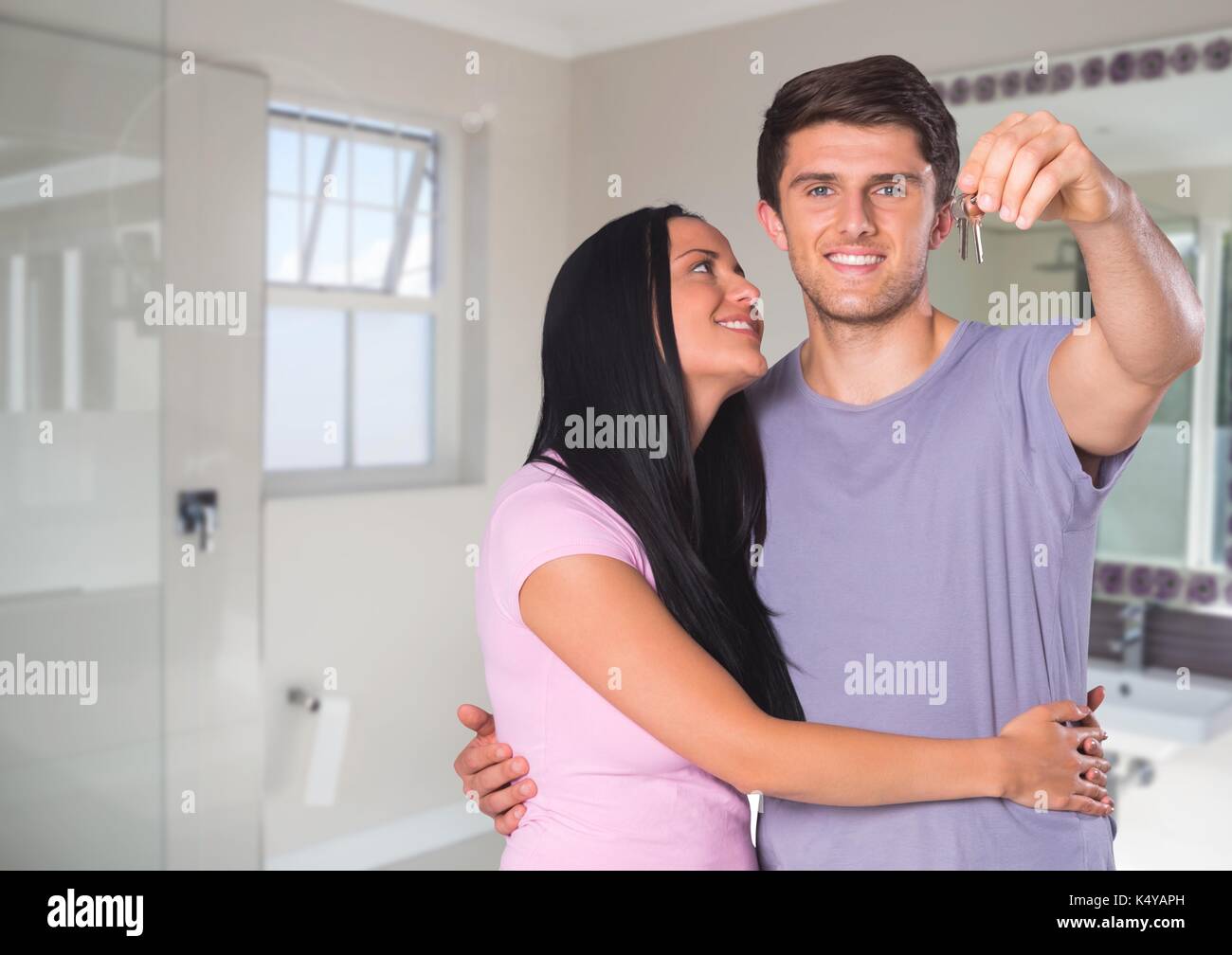 Digital composite of Couple Holding key in bathroom Stock Photo - Alamy