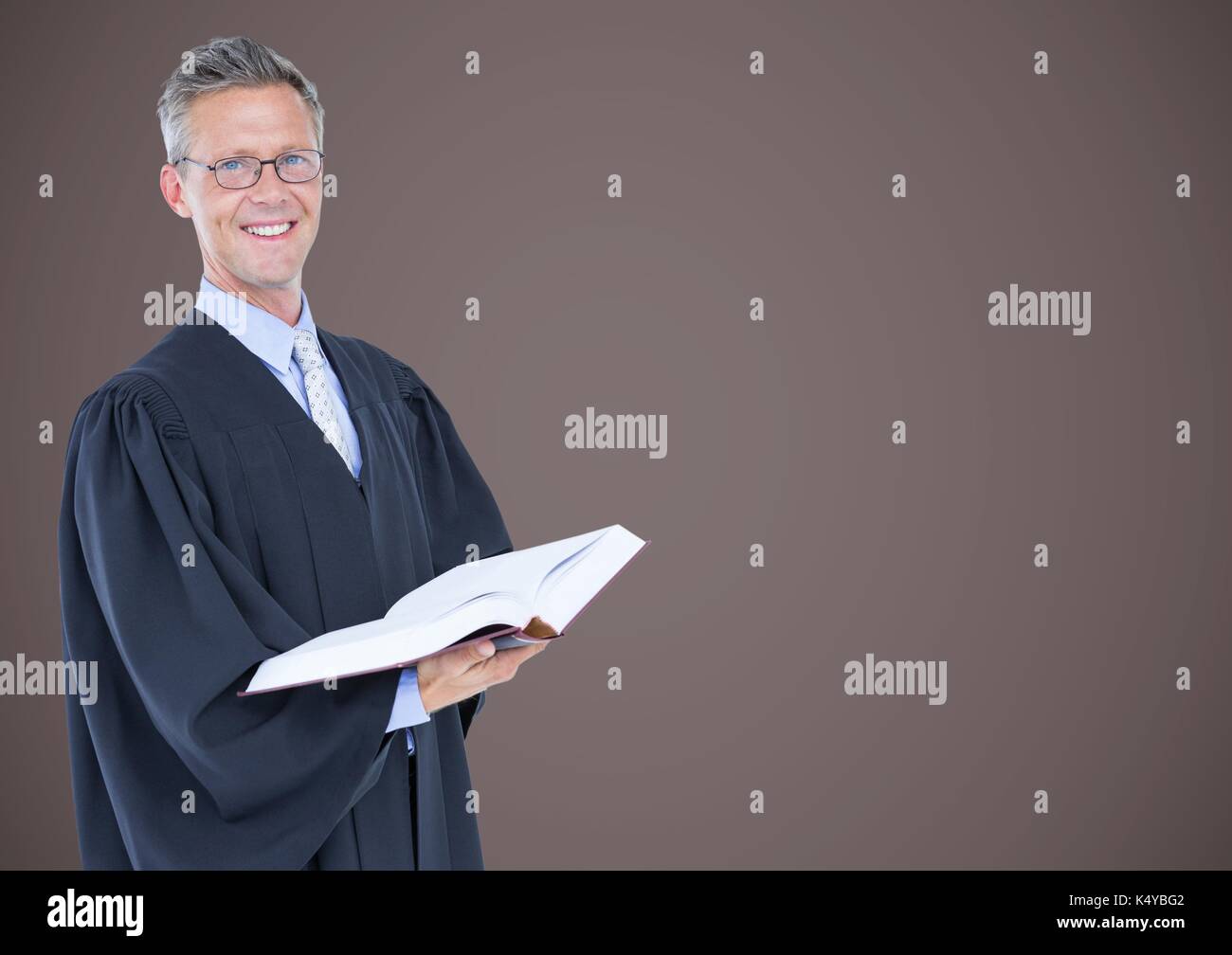 Digital composite of Male judge with open book against brown background ...