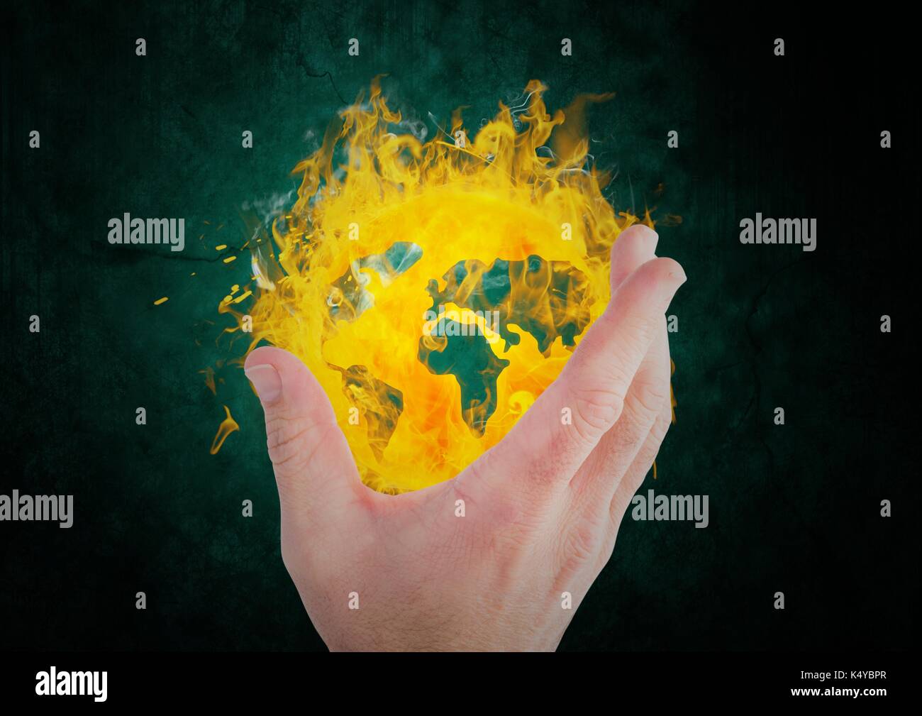 Digital composite of hand taking the earth fire icon. Green and black ...