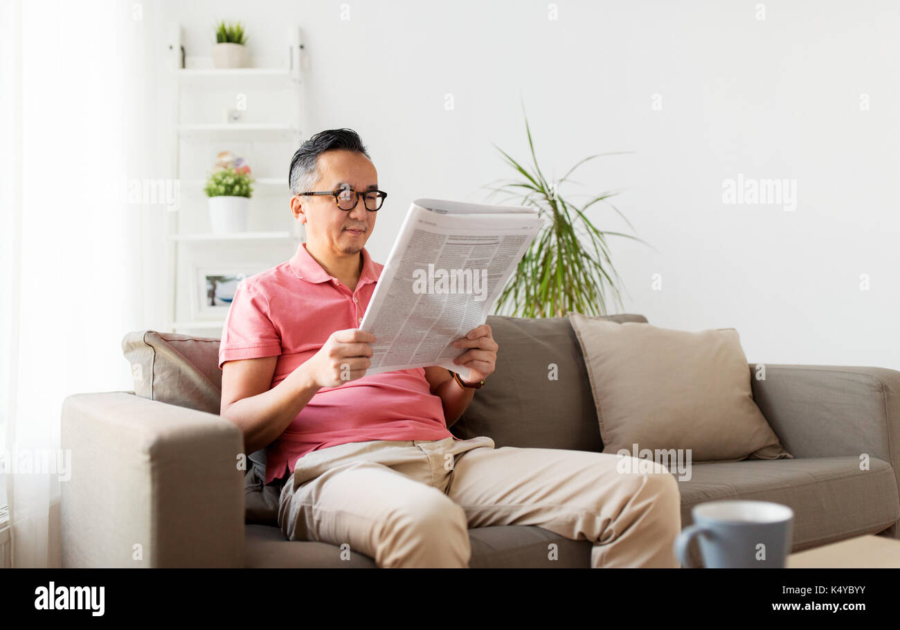 Asian Man Newspaper High Resolution Stock Photography and Images - Alamy