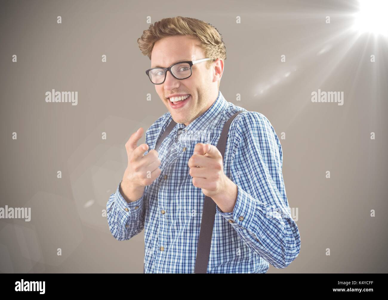 Digital composite of Nerd man pointing against brown background with ...