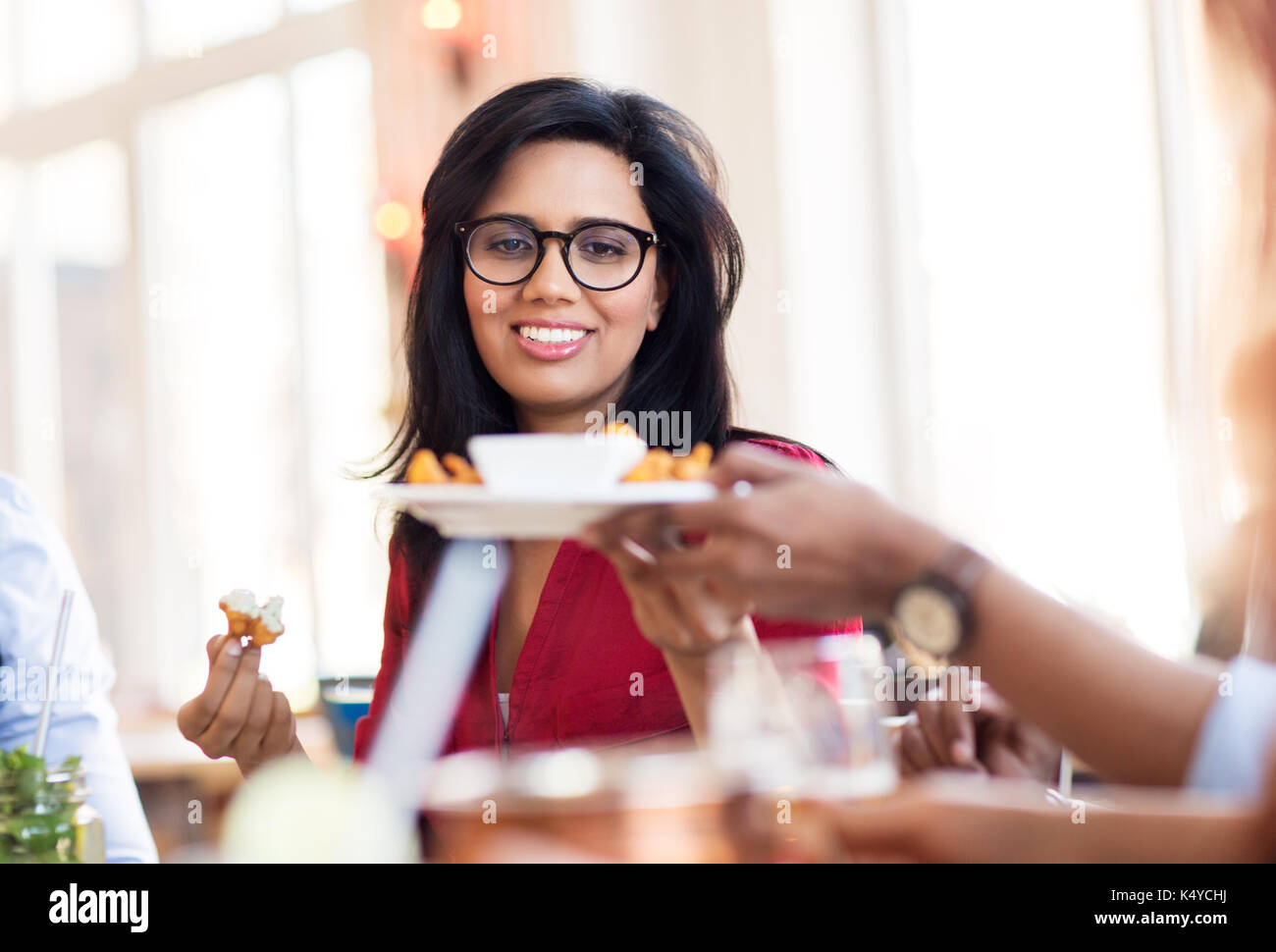 Indian girl eating snack hi-res stock photography and images - Alamy