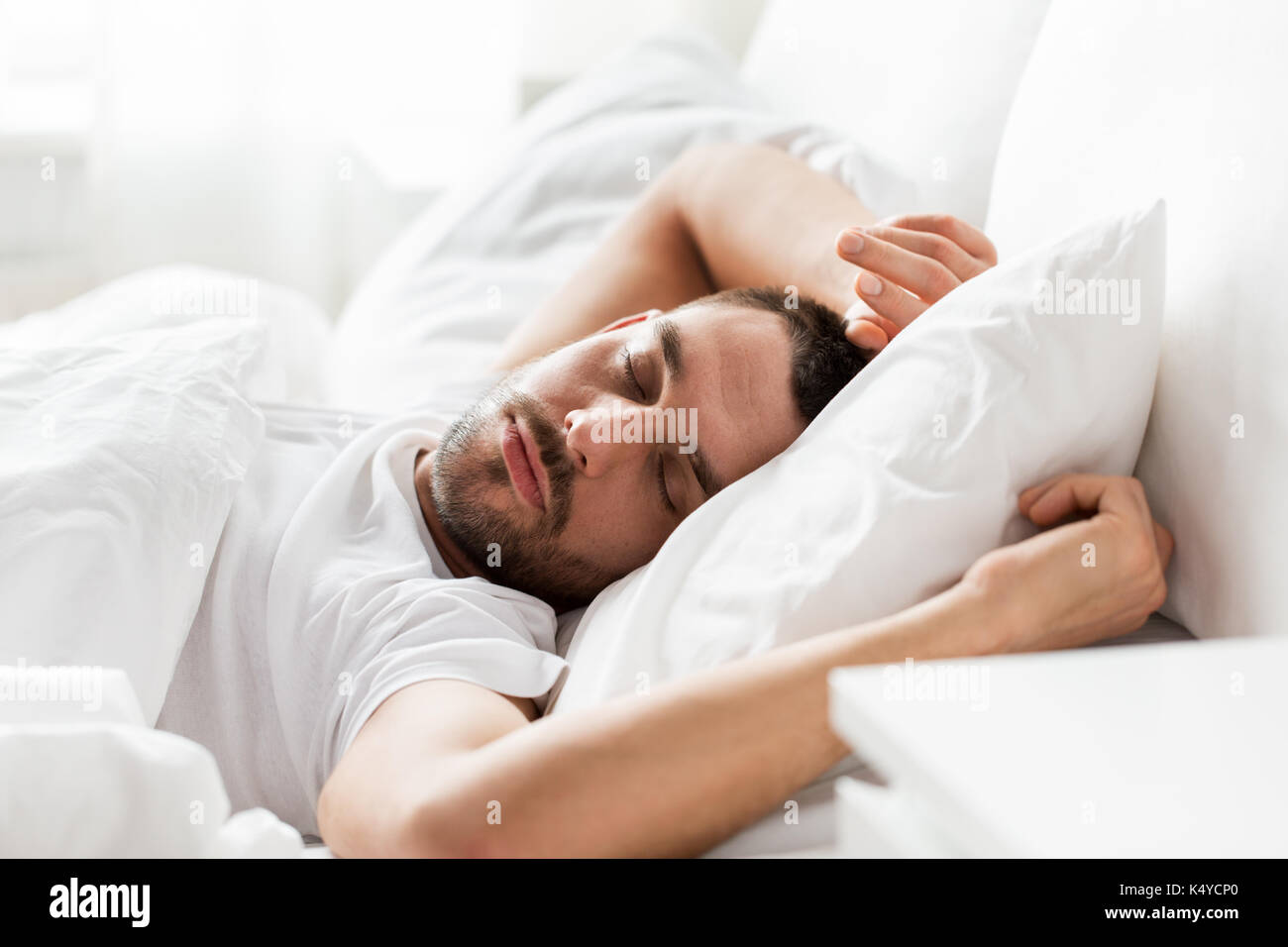 Happy man sleeping hi-res stock photography and images - Alamy