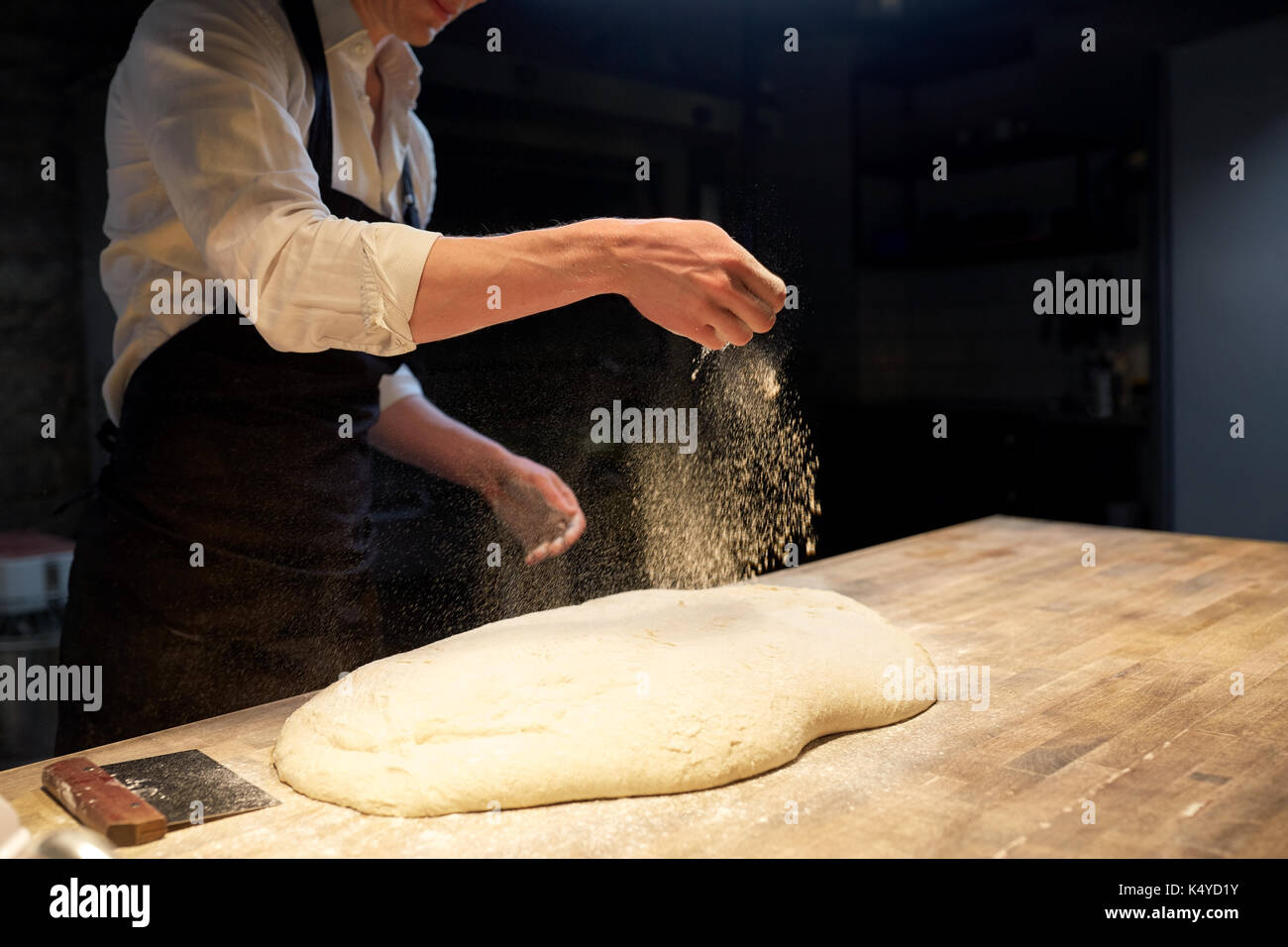 chef or baker making bread dough at bakery Stock Photo - Alamy