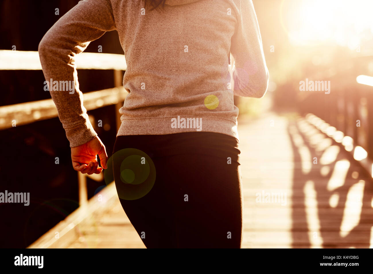 Female jogger running Stock Photo - Alamy