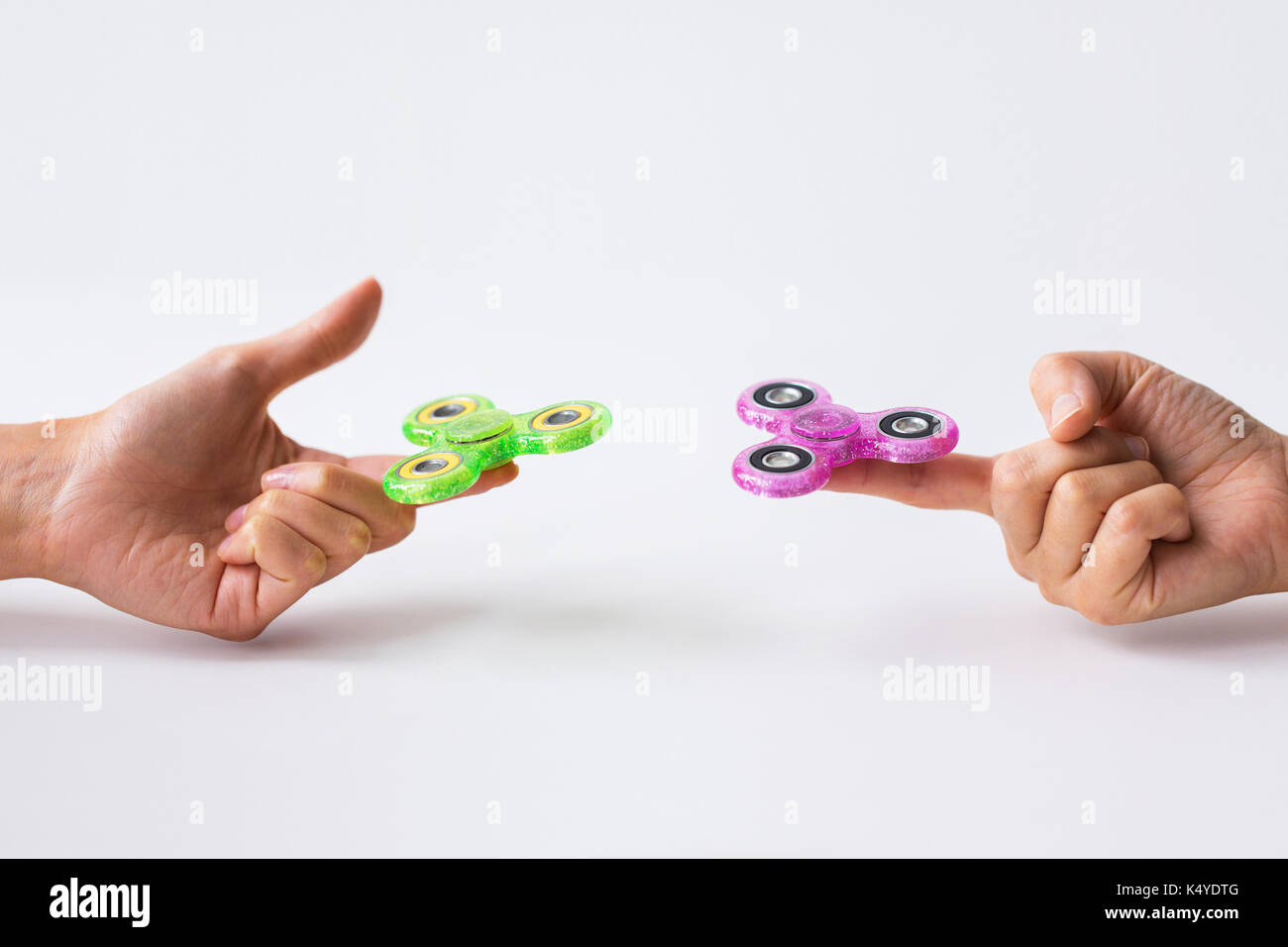 Two hands playing hi-res stock photography and images - Alamy
