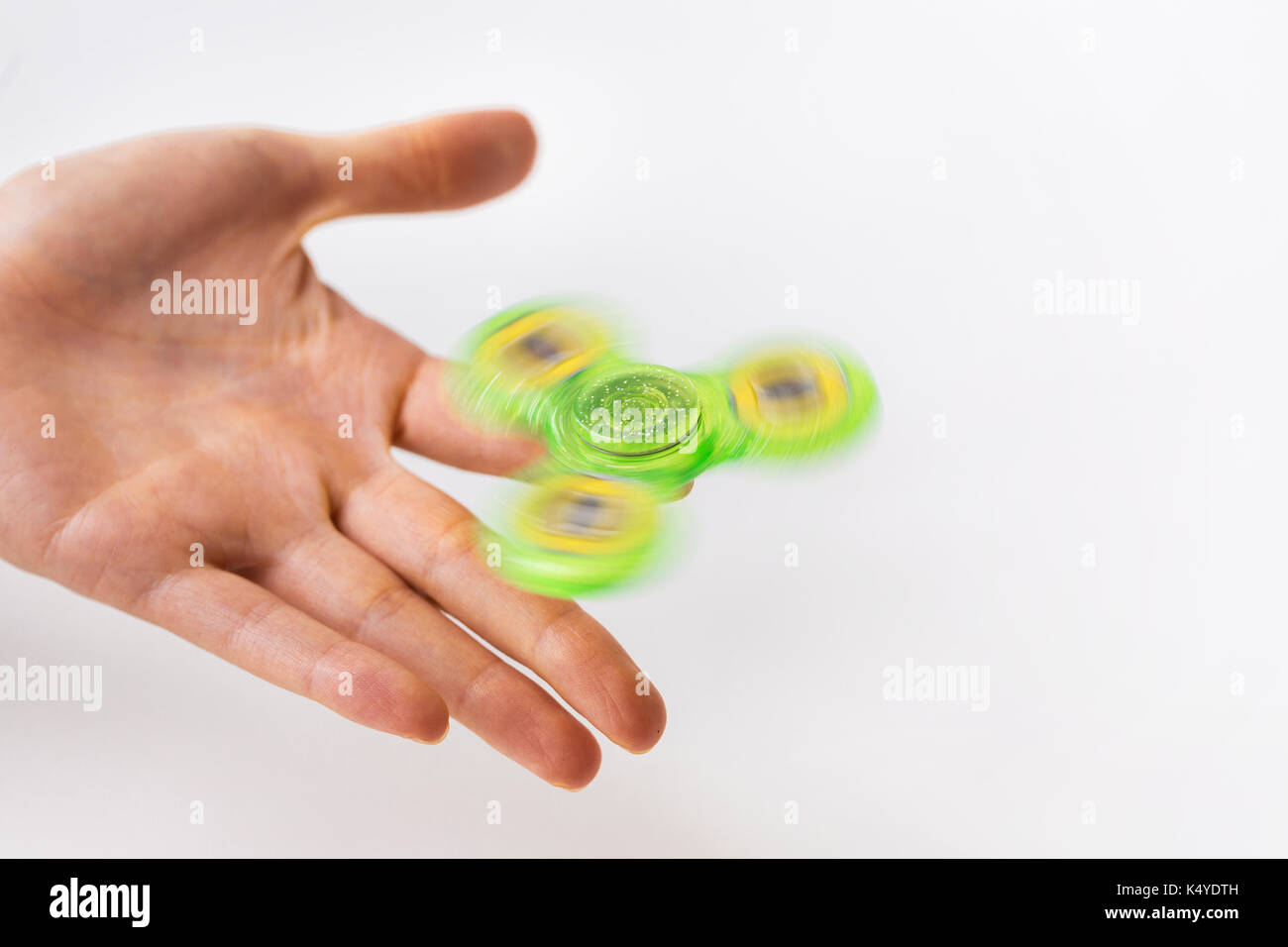 close up of hand playing with fidget spinner Stock Photo - Alamy