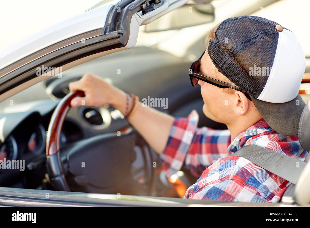 happy young man in shades driving convertible car Stock Photo - Alamy