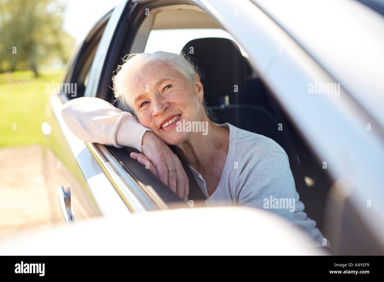 Old woman driving car hi-res stock photography and images - Alamy