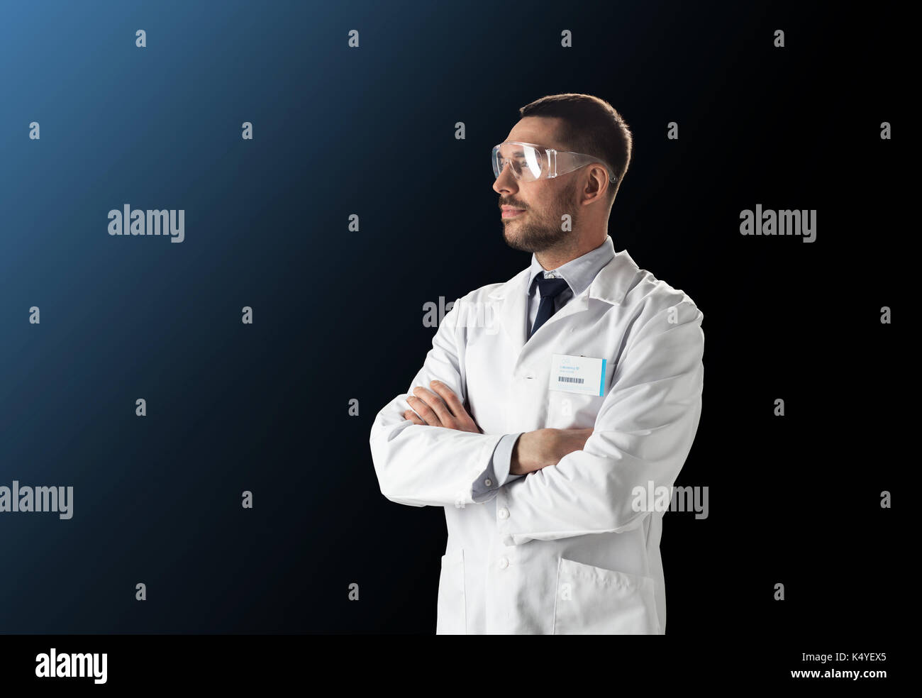 scientist in lab coat and safety glasses Stock Photo - Alamy