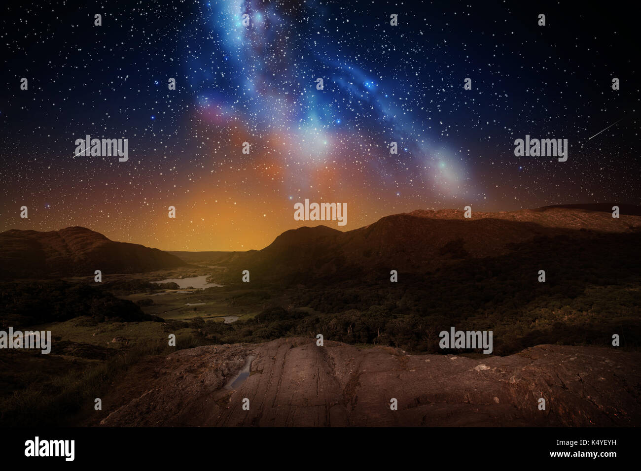 mountain landscape over night sky or space Stock Photo - Alamy
