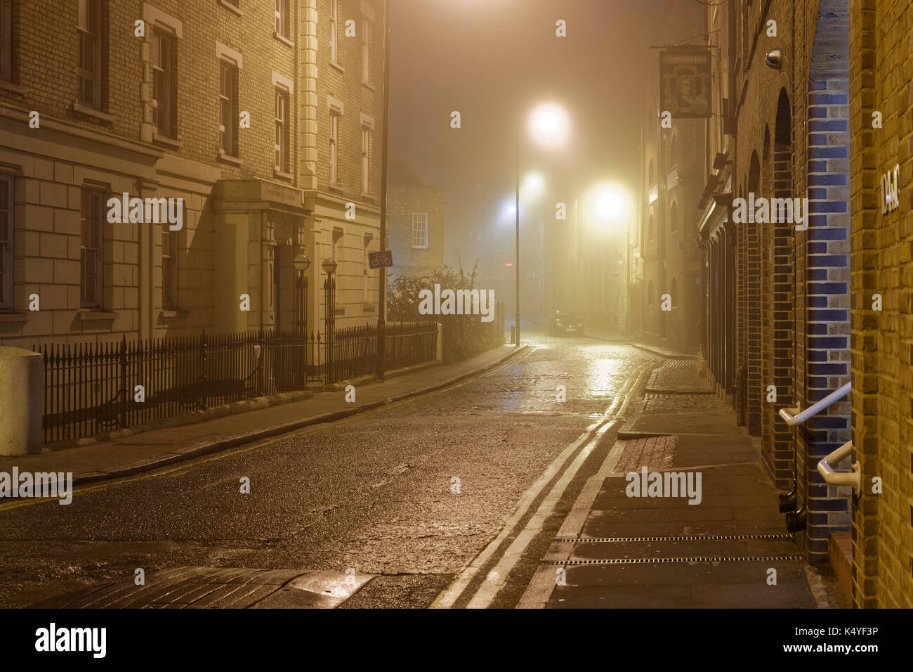 Illuminated alleys of Wapping on the Thames path, London, England ...