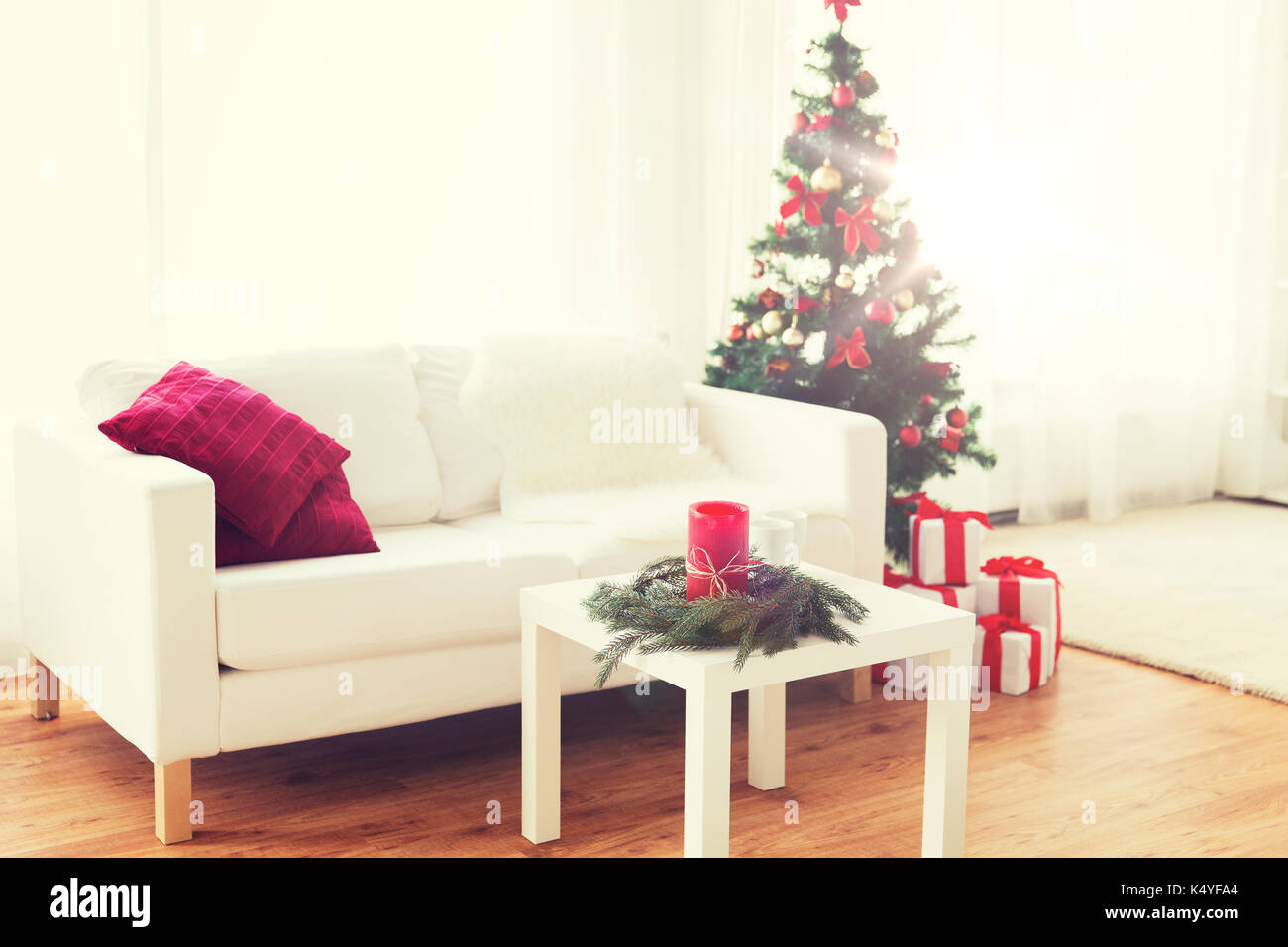 sofa, table and christmas tree with gifts at home Stock Photo - Alamy