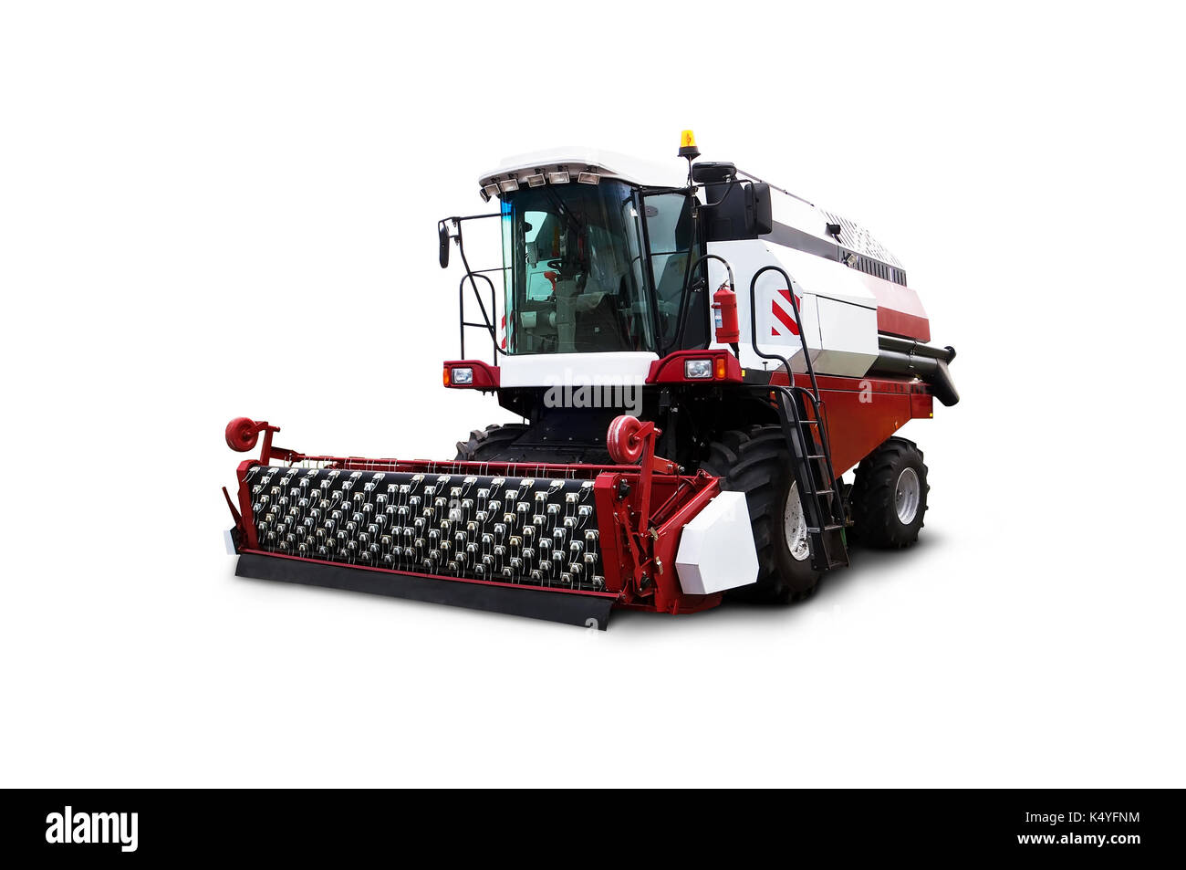 Red modern combine separately on a white background Stock Photo - Alamy