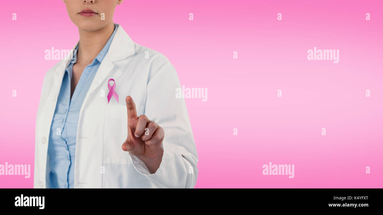 Female doctor using digital screen against pink Stock Photo - Alamy