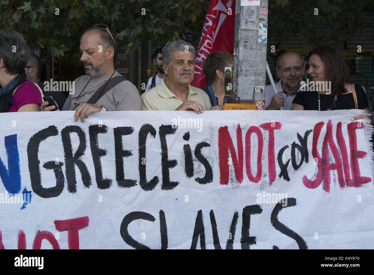 Athens, Greece. 7th Sep, 2017. Protesters hold banners and shout ...