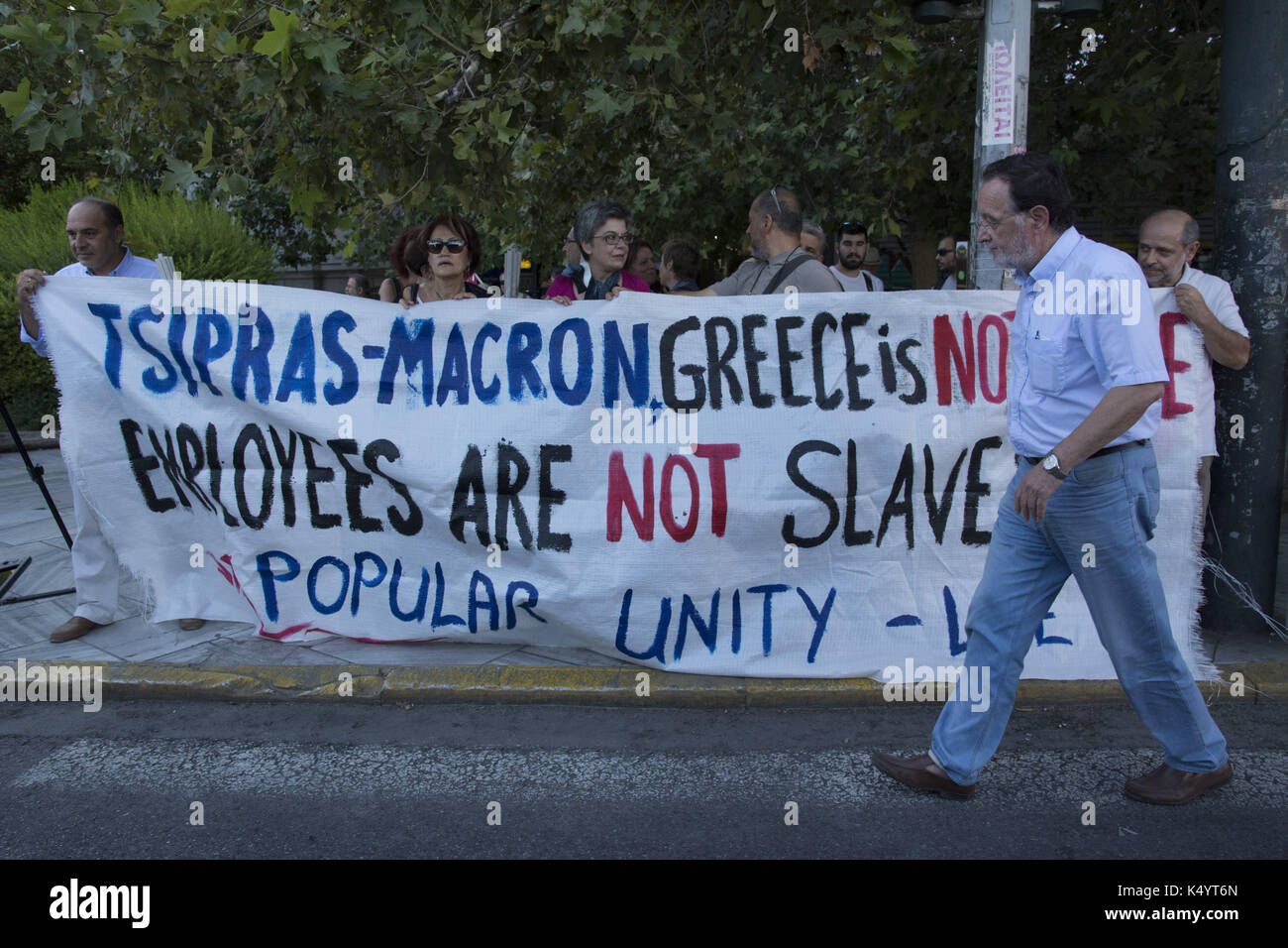Athens, Greece. 7th Sep, 2017. Protesters hold banners and shout ...
