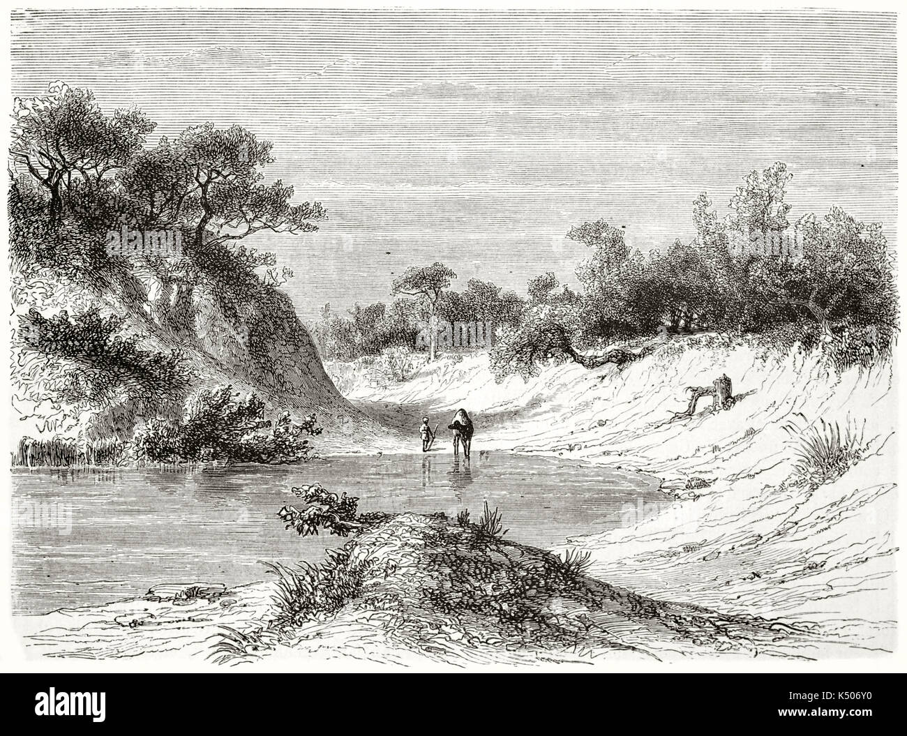 Old view of Rahad river Sudan, the riverbed is almost dry and a camel ...
