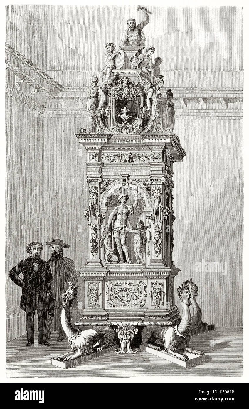 Ancient high big clay stove richly decorated in neoclassical style with ...