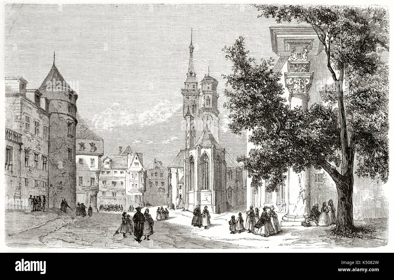 Ancient medieval square with a high tree foreground, people and stone ...