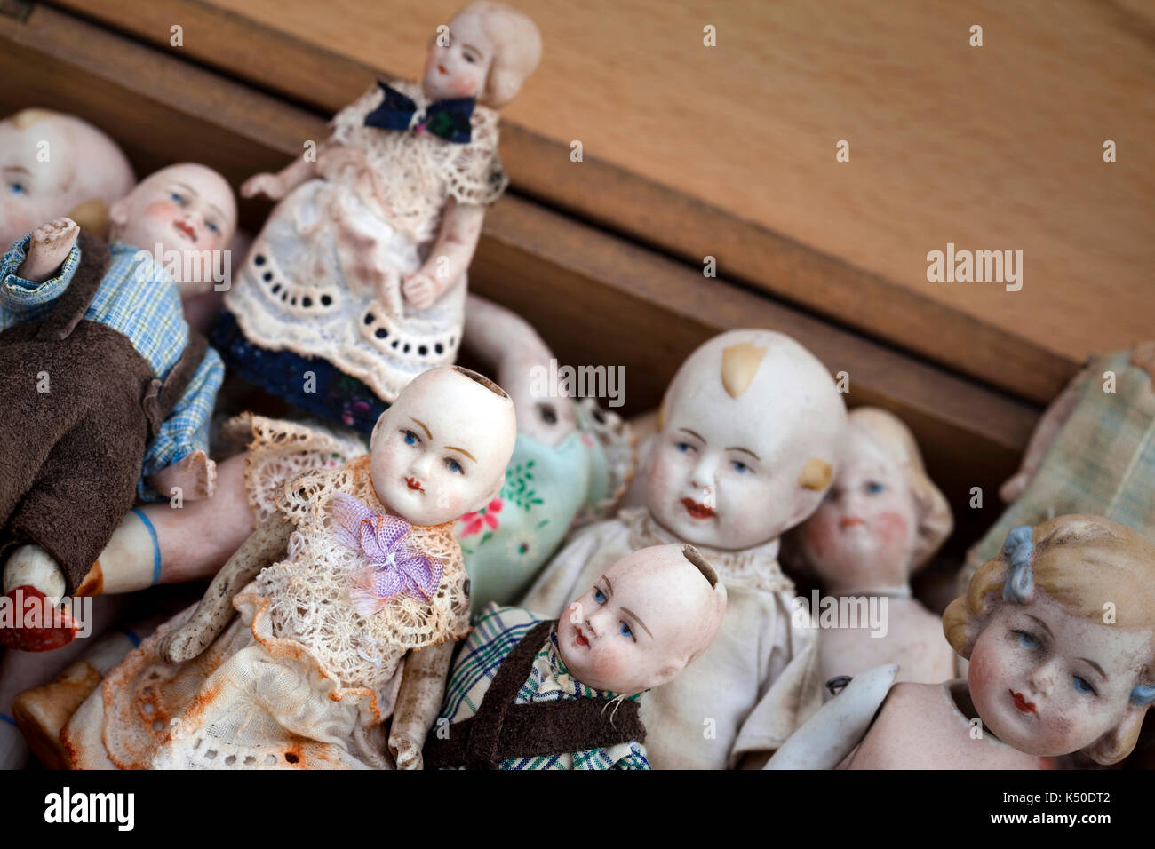 Vintage porcelain dolls on a flea market stall Stock Photo - Alamy