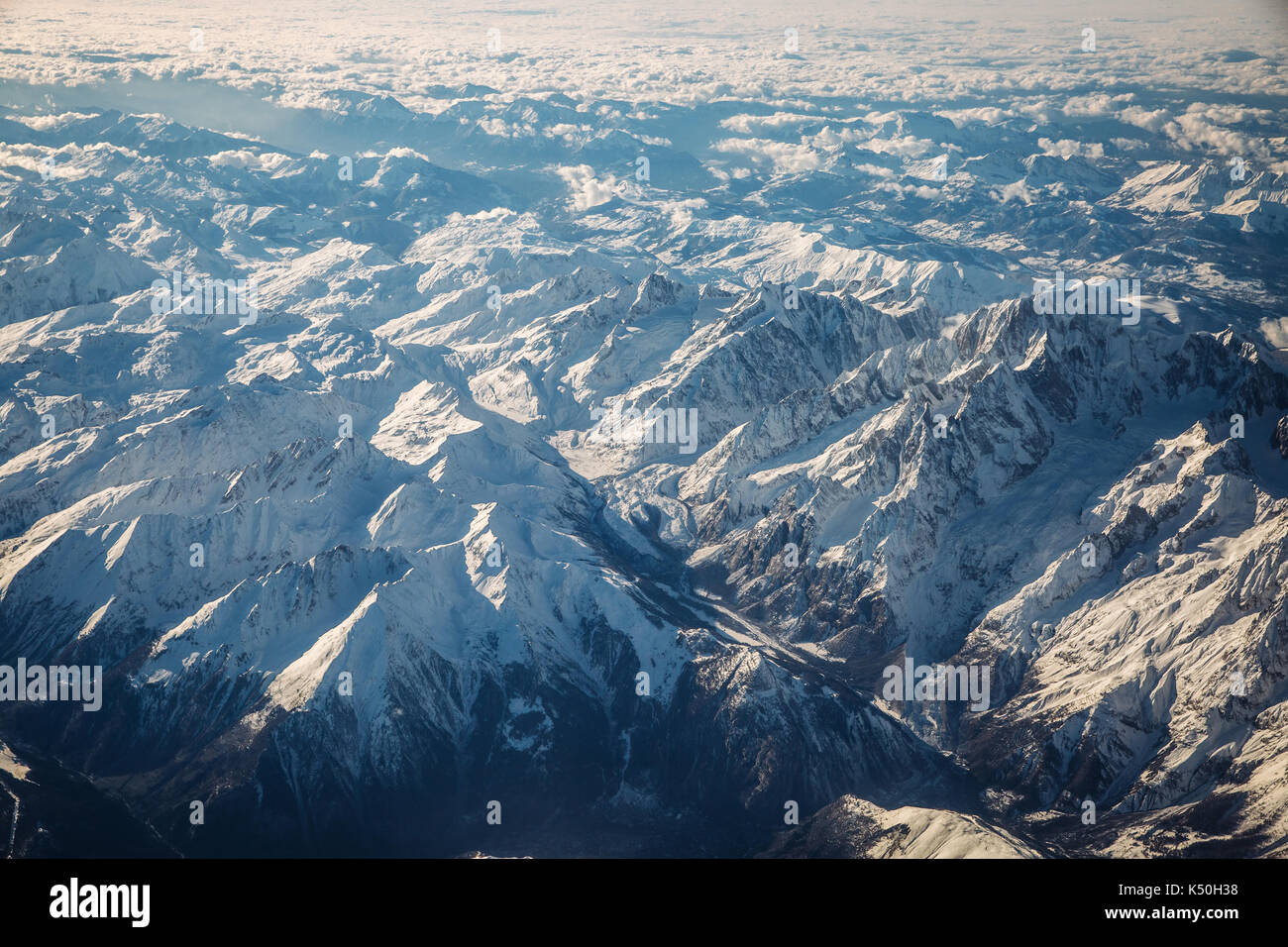 Breathtaking view of the Alps mountains from the airplane window Stock ...