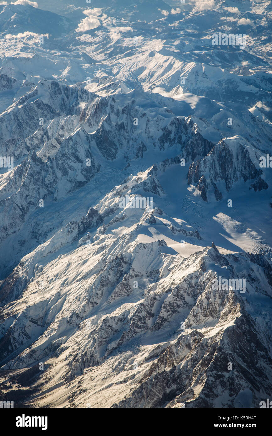 Breathtaking view of the Alps mountains from the airplane window Stock ...