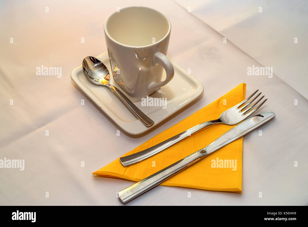 Table setting on white background Stock Photo - Alamy