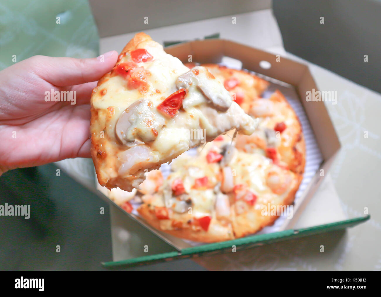 pick a piece of pizza Stock Photo - Alamy