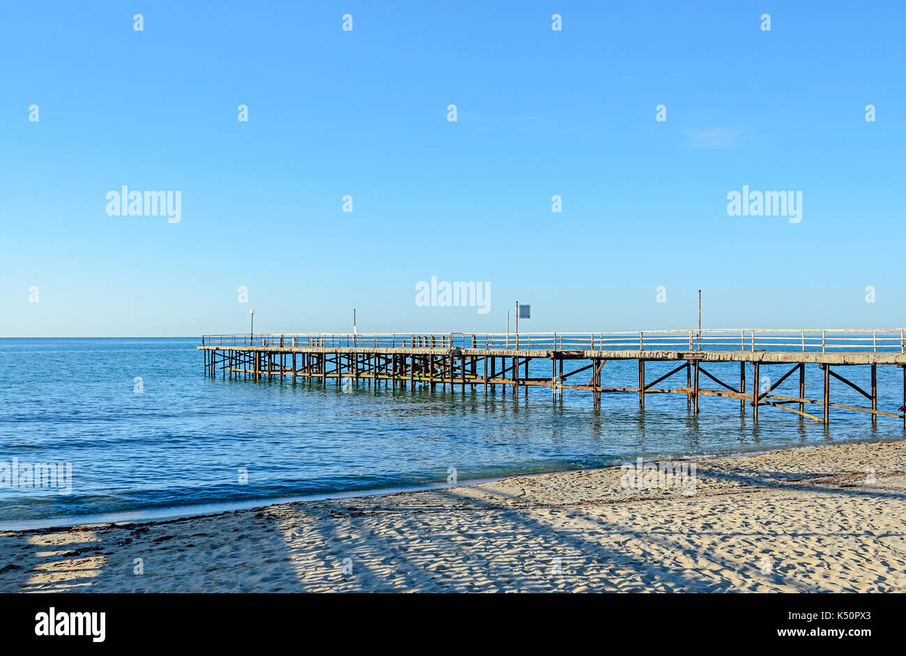 Seaside bridge with kissing points and benches on Black Sea, blue clear ...