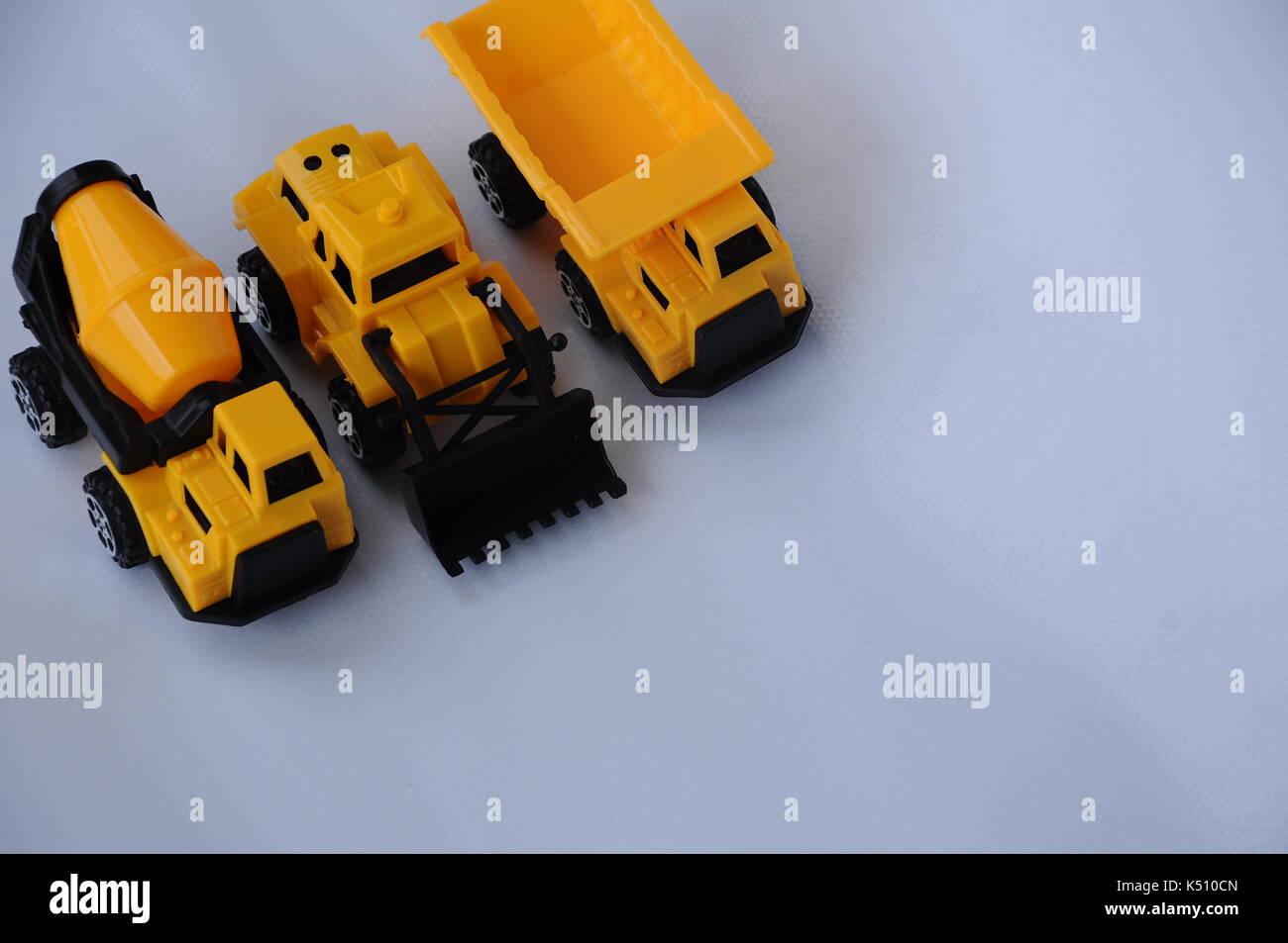 Group of small heavy construction machine toy, lorry, bulldozer and ...