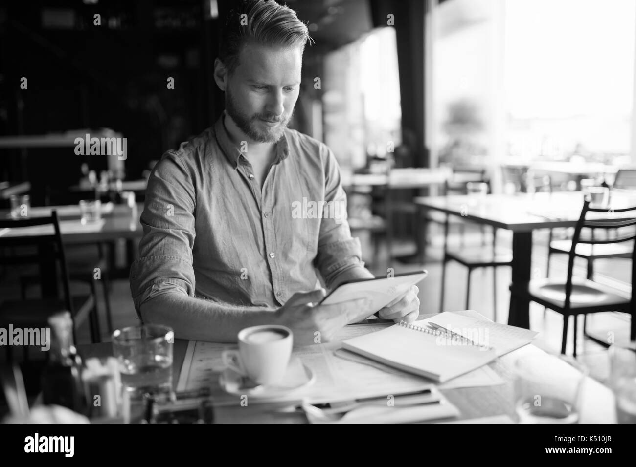 Adult businessman using digital Black and White Stock Photos & Images ...
