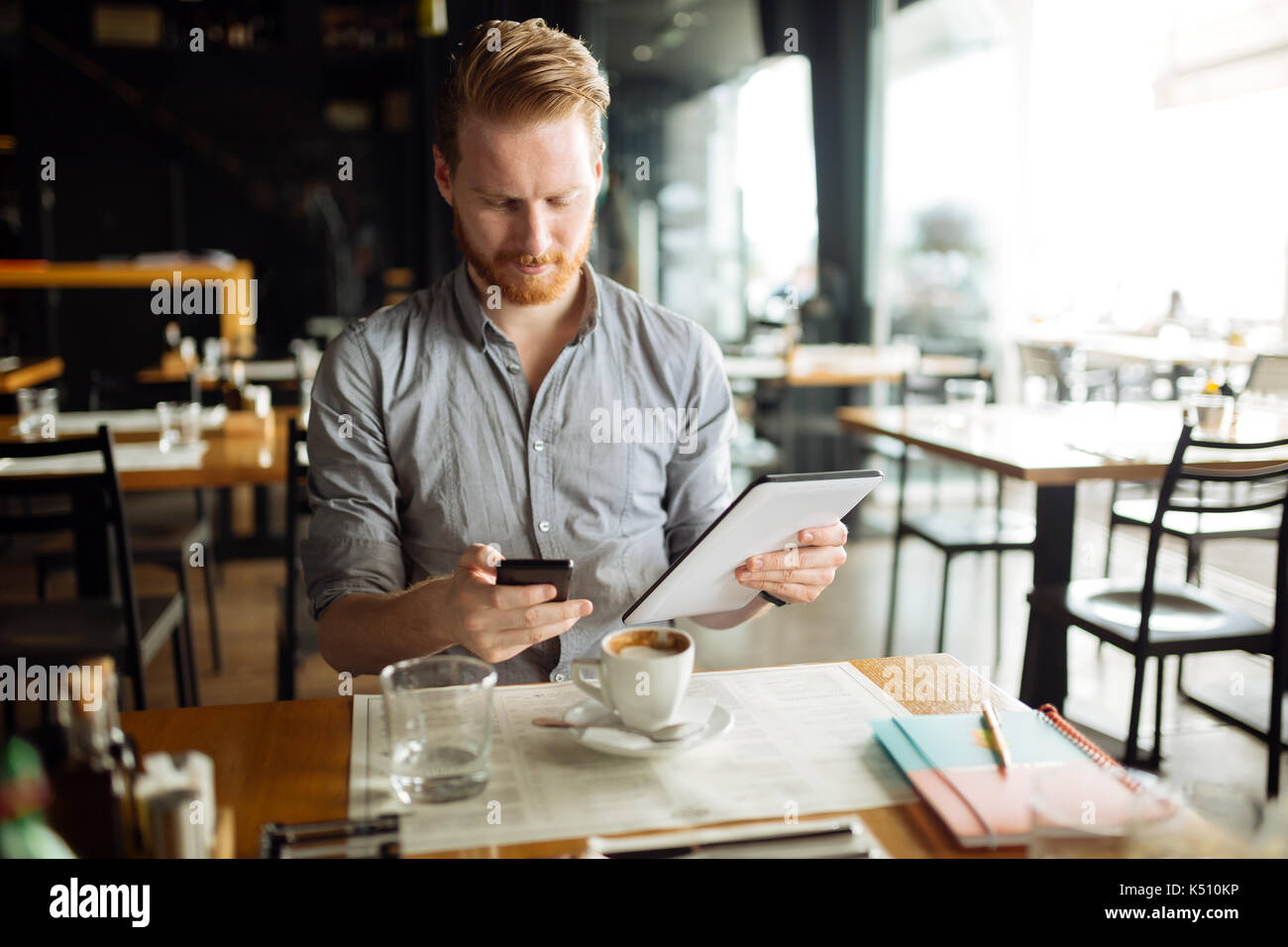 Businessman constantly working Stock Photo - Alamy
