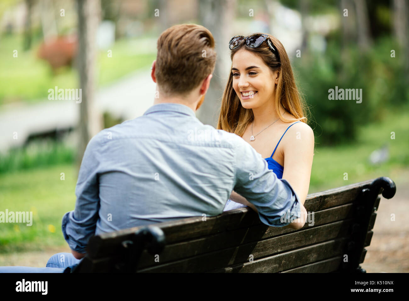 Romantic couple in park Stock Photo - Alamy