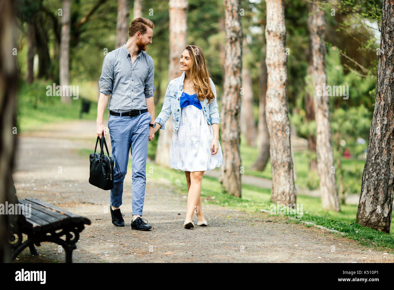 Beautiful couple taking a walk in nature Stock Photo - Alamy
