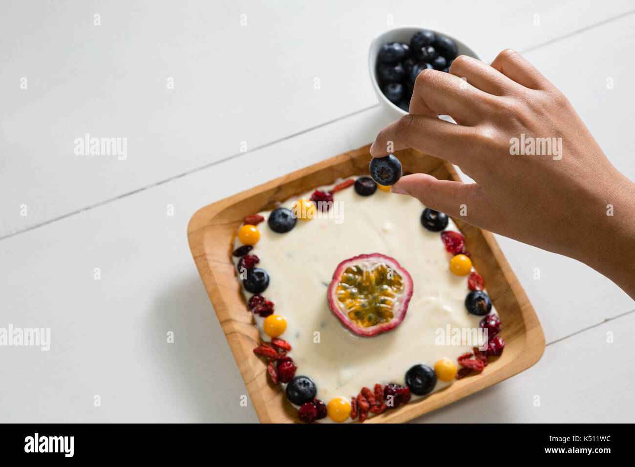 Woman having healthy breakfast on white background Stock Photo - Alamy