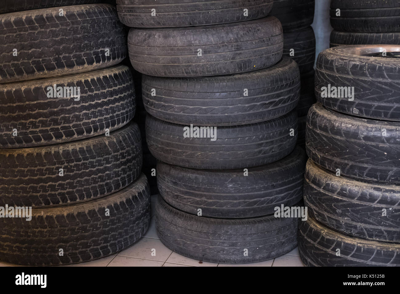 pile of car wheel in garage. vehicle tire in auto repair service. old ...