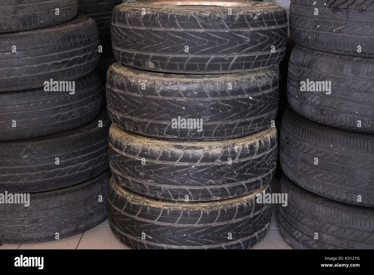 pile of car wheel in garage. vehicle tire in auto repair service. old ...
