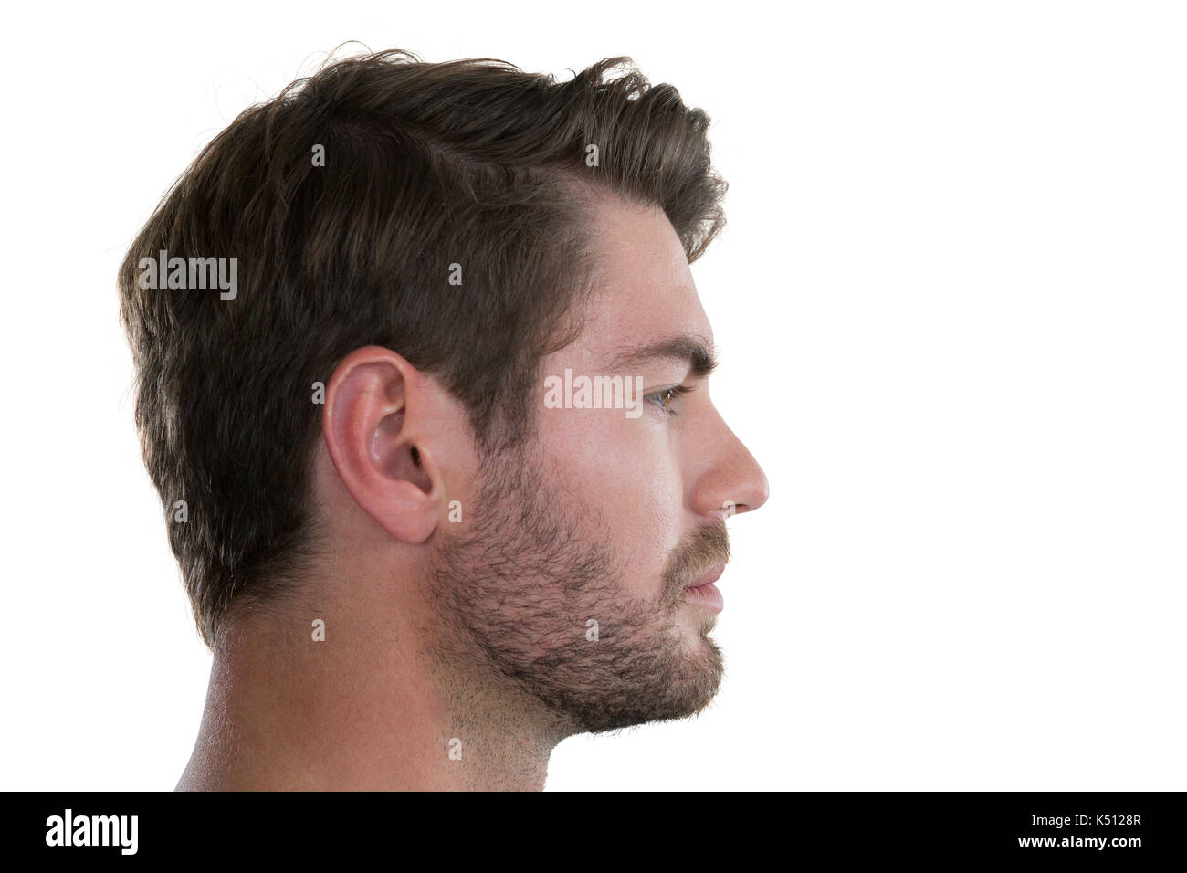 Side view of man standing against white background Stock Photo - Alamy