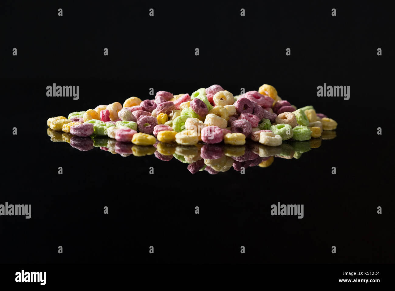 Close-up of froot loops on black background Stock Photo - Alamy